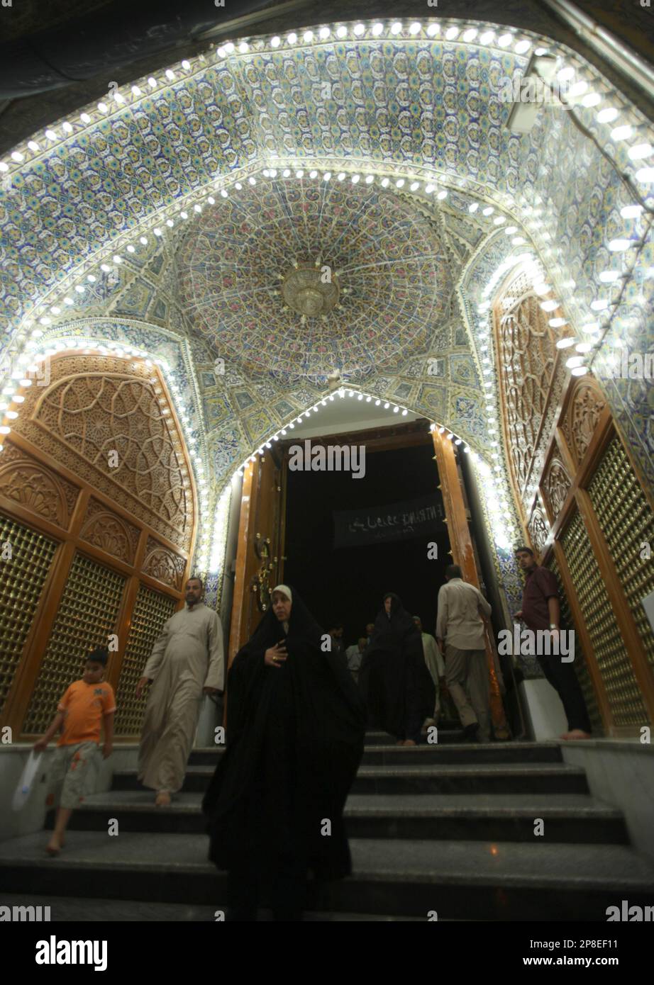 Pilgrims walk inside the holy Shiite shrine of Imam Kazim in Kazimiyah ...