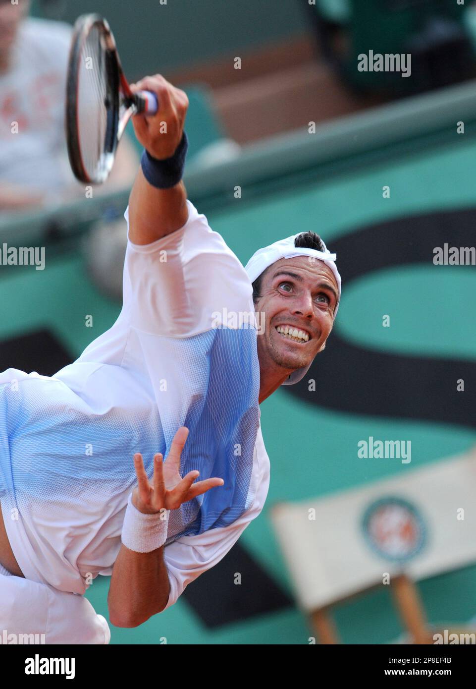 Argentina's Juan Ignacio Chela serves the ball to Britain's Andy Murray ...