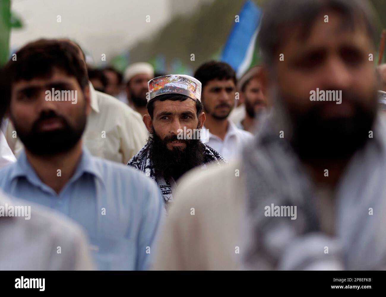 A supporter of a Pakistani religious party 'Jamaat-e-Islami' with a ...