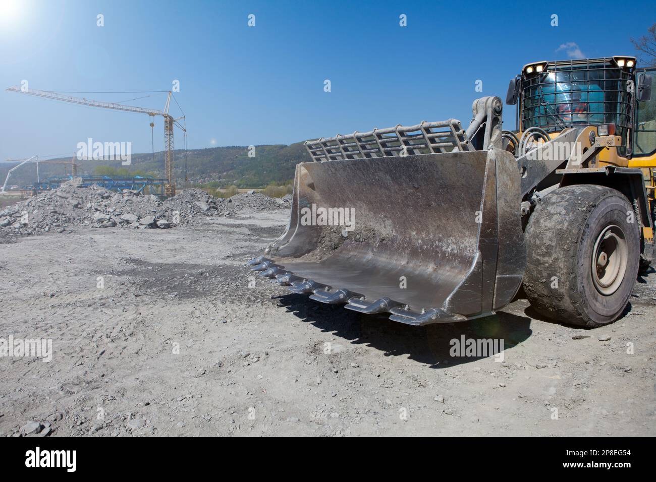 loader on road construction site. Wheel loader during earth moving ...