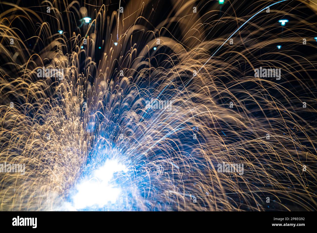Yellow ground fireworks on asphalt exploding Stock Photo - Alamy