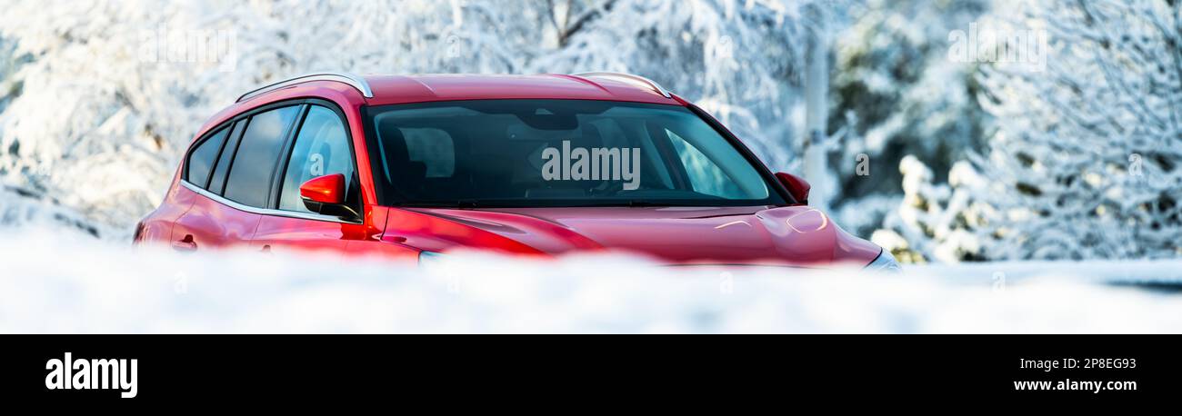 Red estate car on a parking lot in winter Stock Photo - Alamy