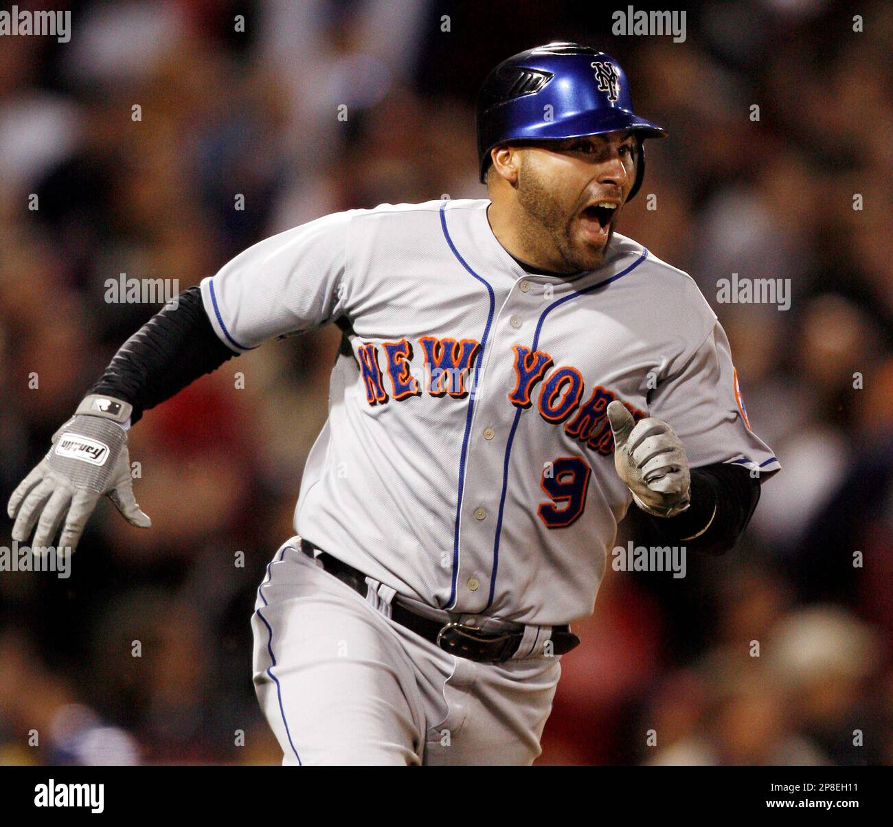 New York Mets' Omir Santos shouts while running the bases after hitting ...