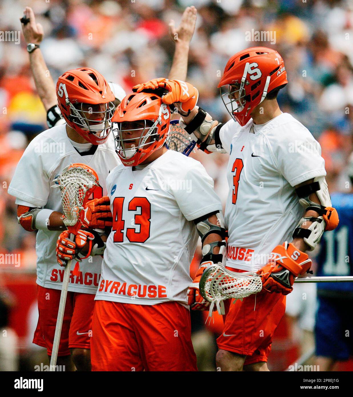 Syracuse's Cody Jamieson, center, celebrates his goal with Matt Abbott ...