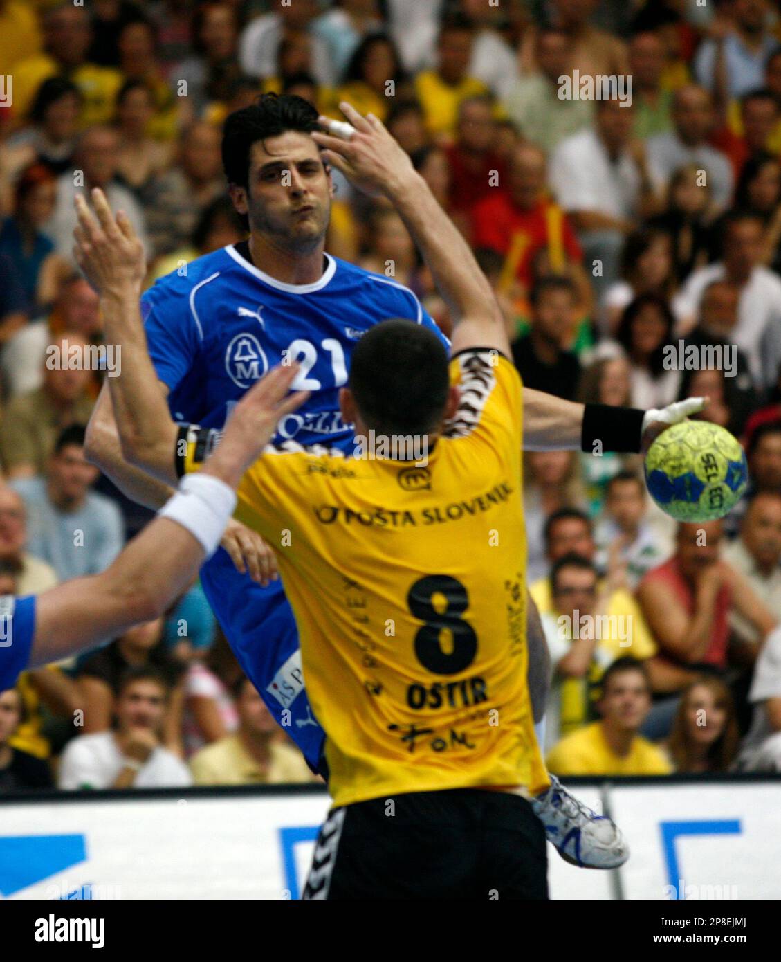 Alexis Alvanos of Germany's VfL Gummersbach, back, tries to score ...