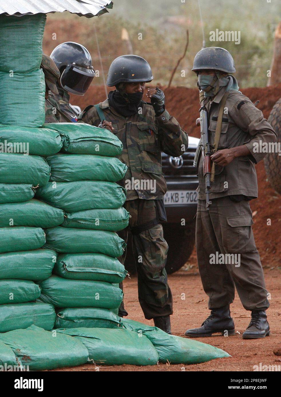 Government soldiers stand guard at at Manik Farm displaced persons camp ...