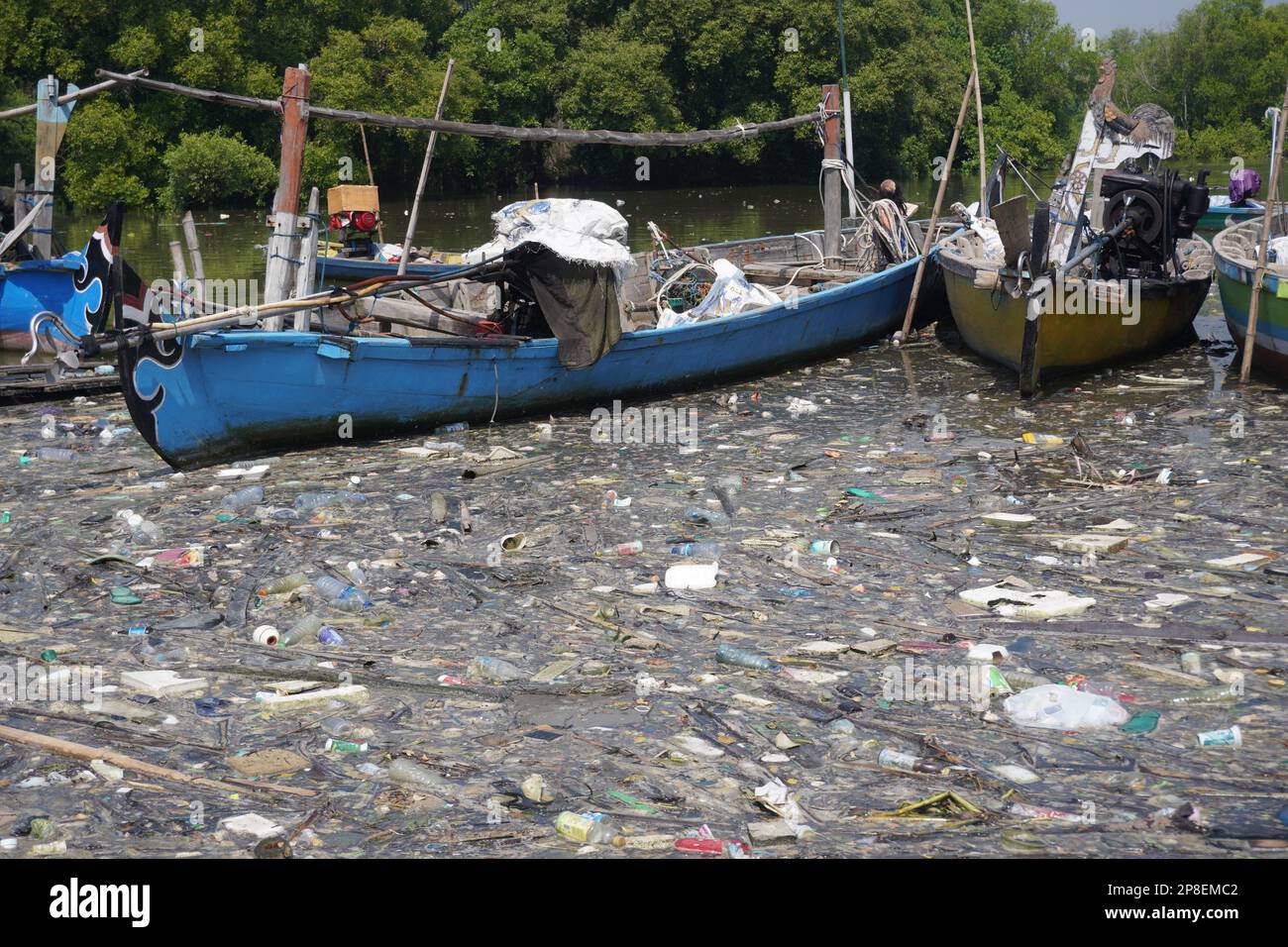 a collection of traditional fishing boats made of wood docked at the ...