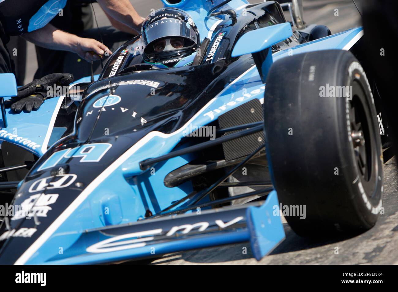 Tomas Scheckter, of South Africa, sits in his car before beginning his ...
