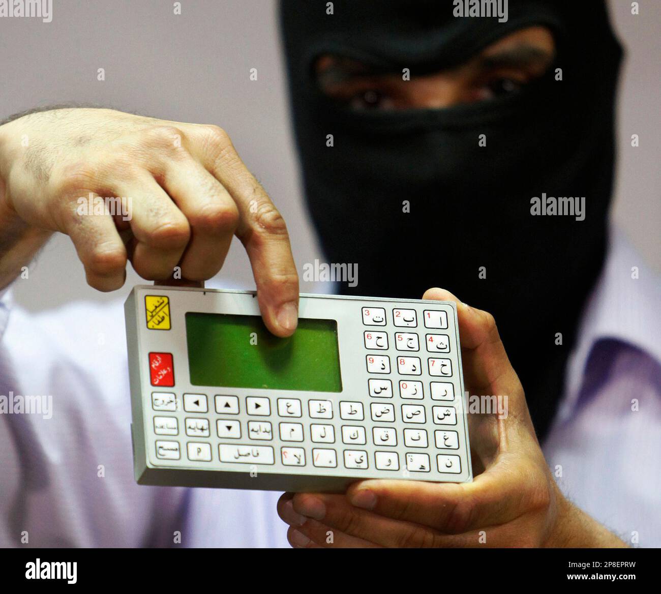 FILE - In this Monday, May 11, 2009 file photo, a masked police officer ...