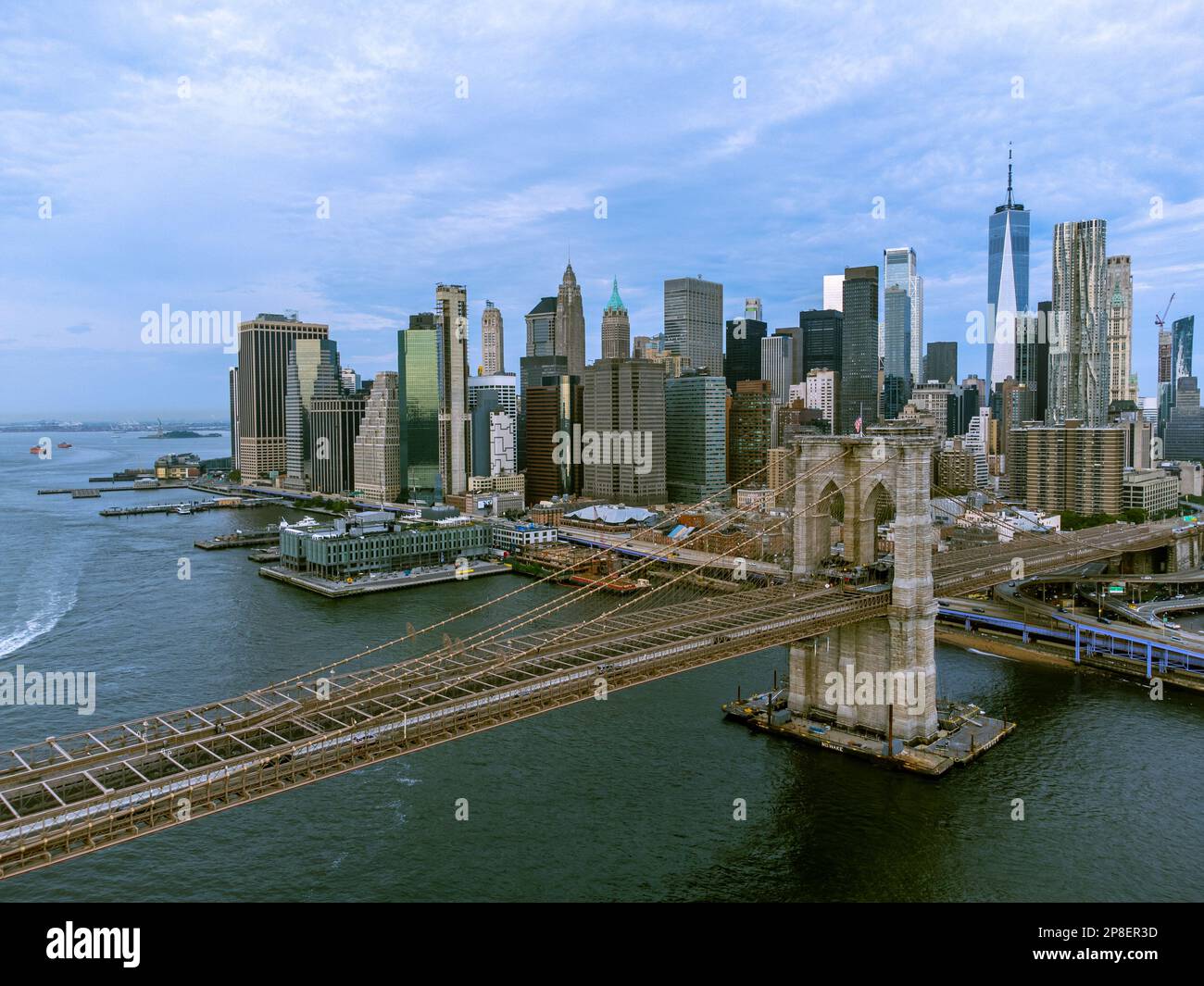 Aerial view of cityscape and Brooklyn Bridge across East River ...