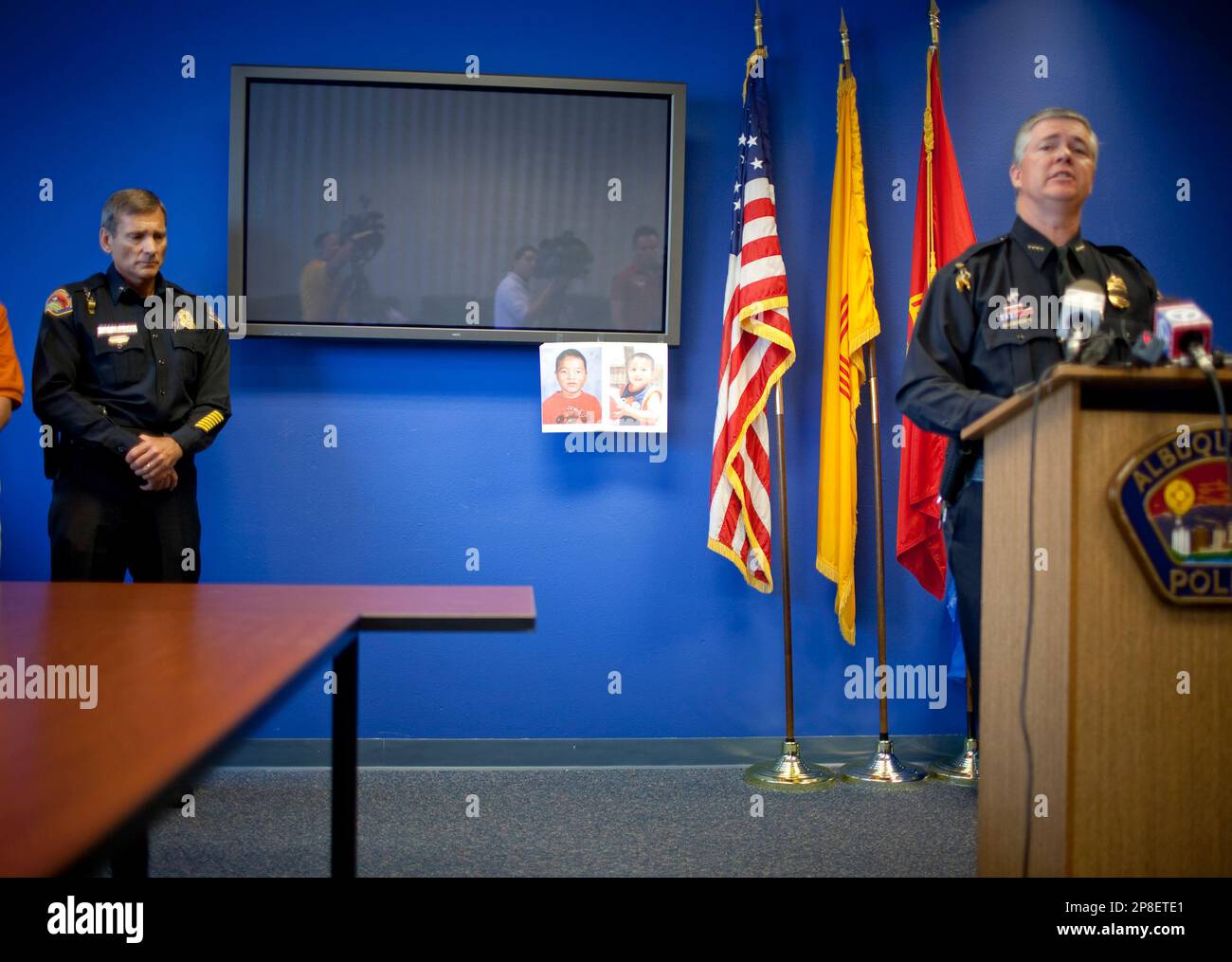 Albuquerque Police Commander, Michael Geier, left, listens during a ...