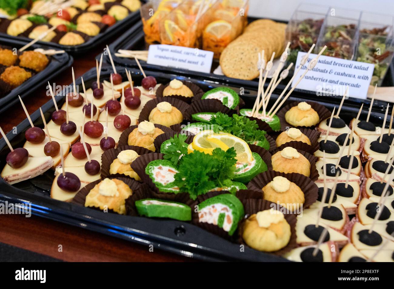 Close-up overhead view of plastic trays with assorted canapes Stock ...