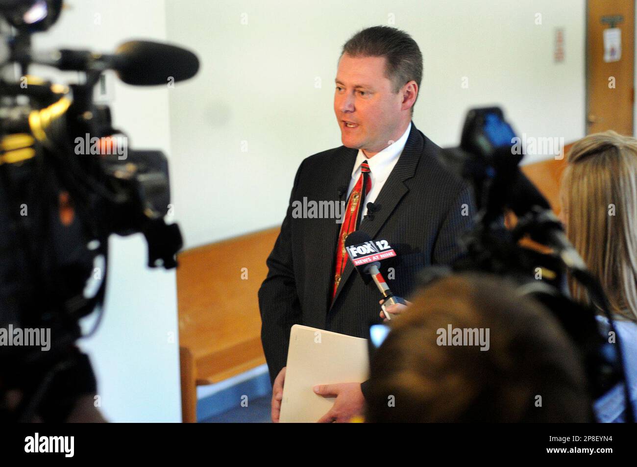 Canyon County Prosecutor John Bujak speaks to the media after the ...