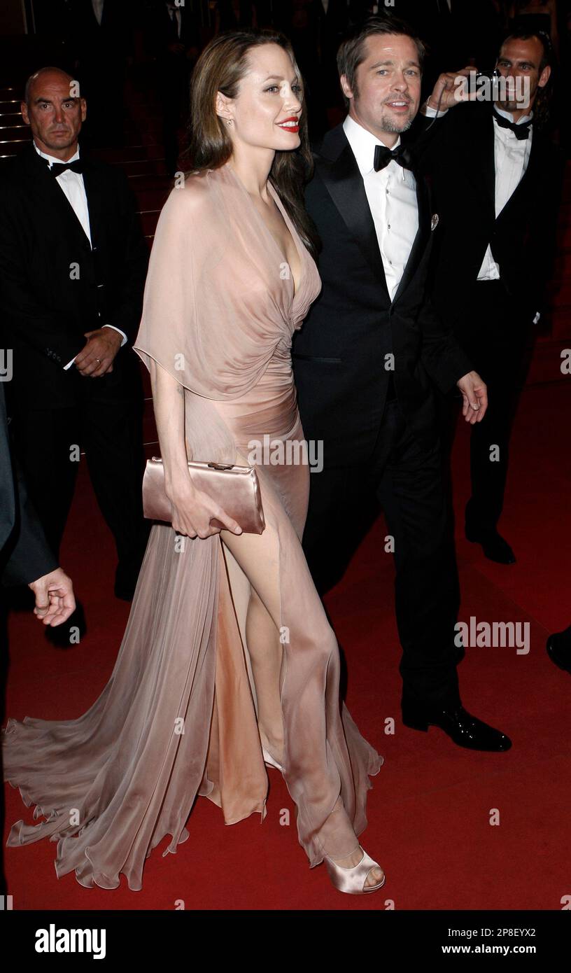 American actors Angelina Jolie, left, and Brad Pitt depart following ...