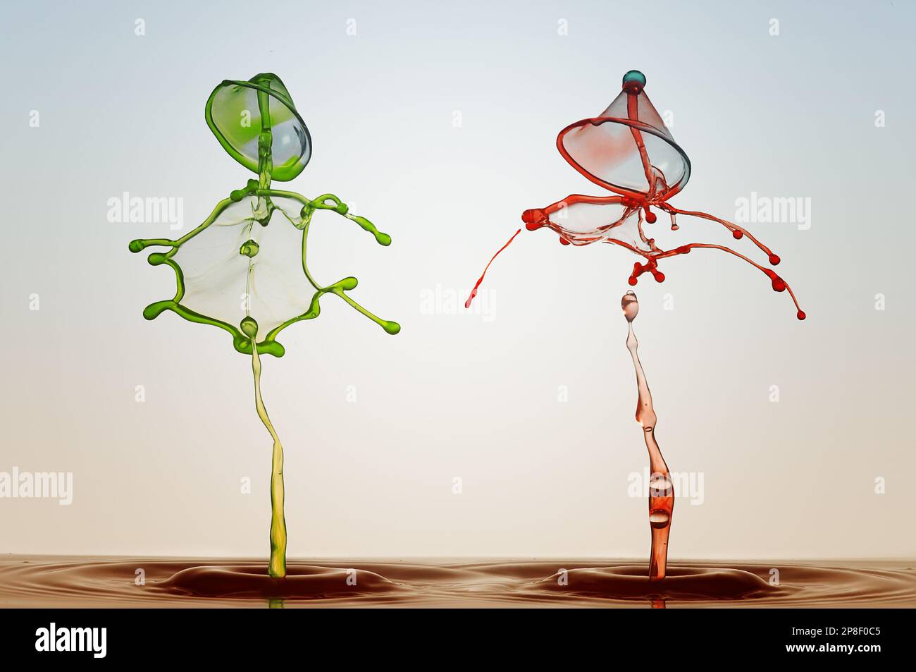 Close-up of two water droplets and splash crowns Stock Photo - Alamy