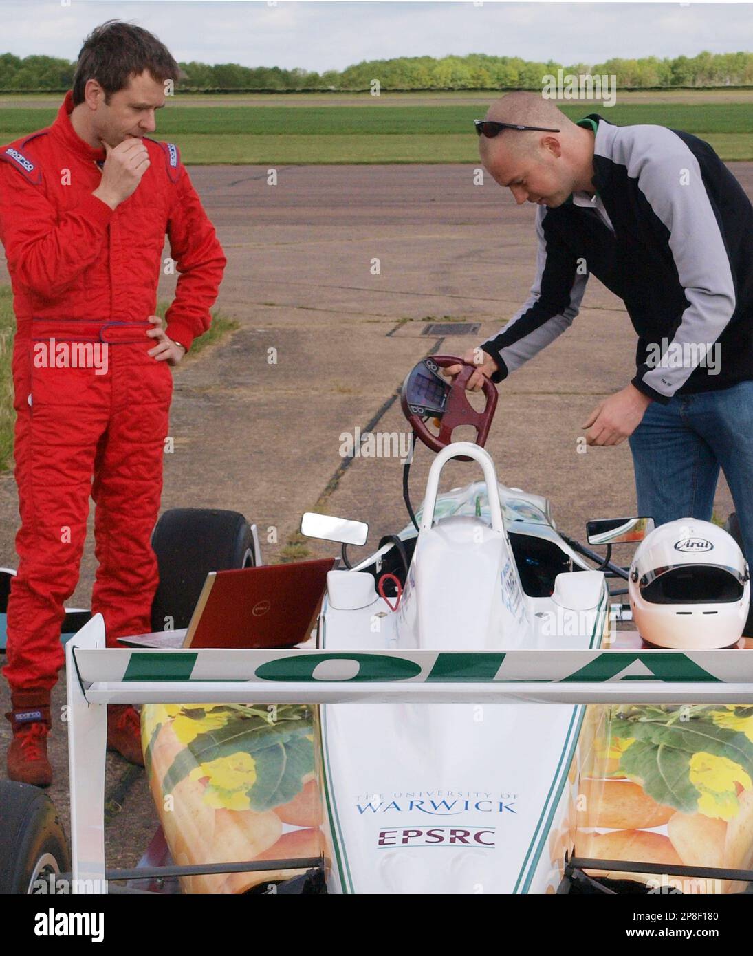 Steve Lambert of Warwick University,right, holds the steering wheel ...