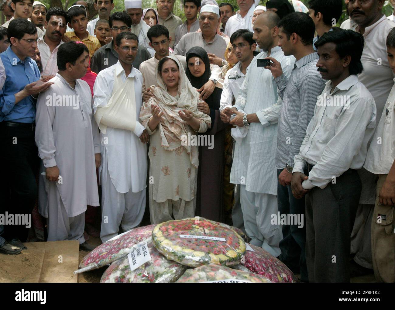 family members Maj. Abid Majeed Malik, who lost his life during a ...