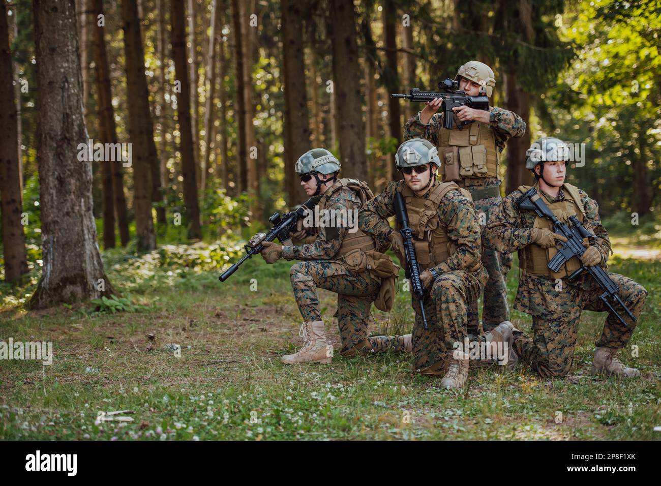 Soldier fighters standing together with guns. Group portrait of US army ...