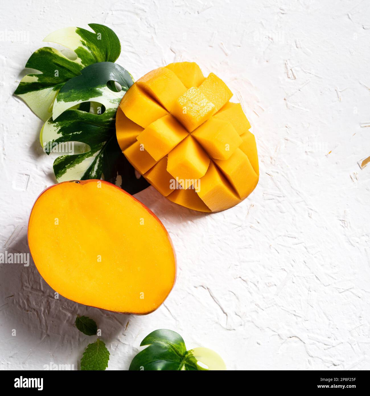 Mango background design concept. Top view of diced fresh mango fruit ...