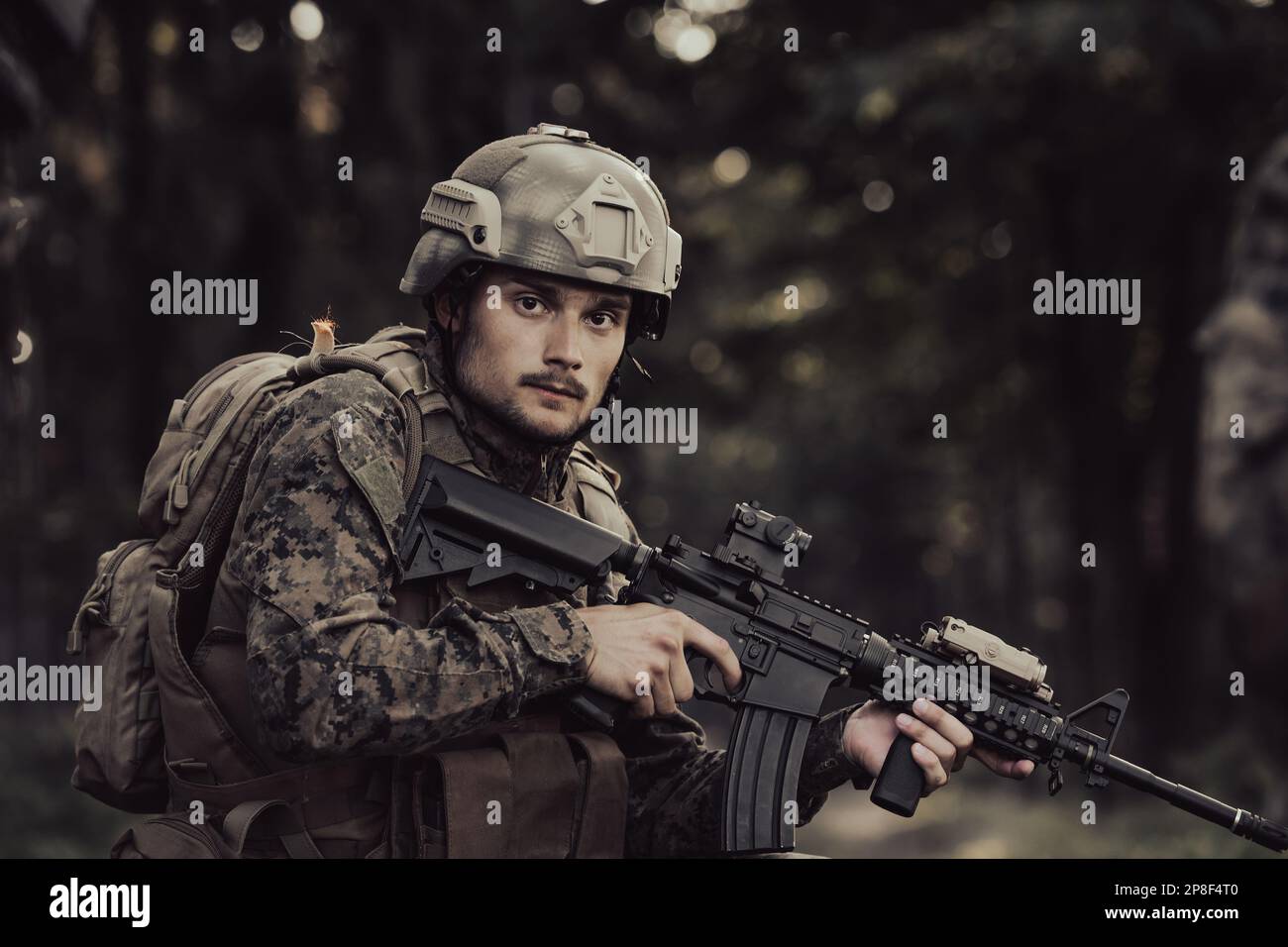 A modern warfare soldier on war duty in dense and dangerous forest ...