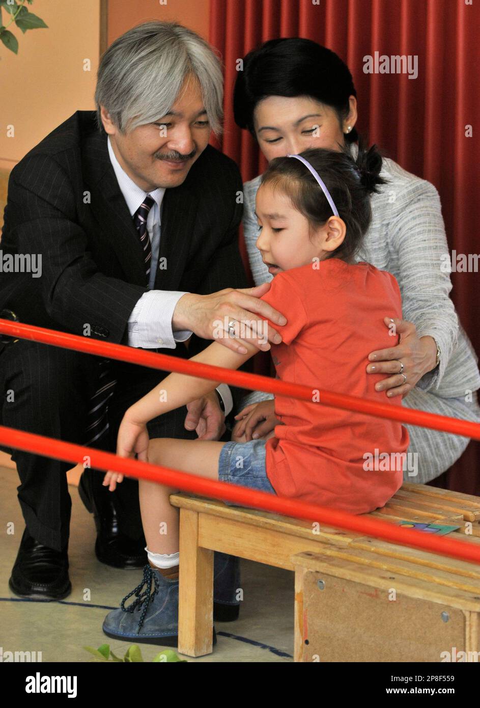 Japanese Princess Kiko, left, and Prince Akishino, right, comfort a ...