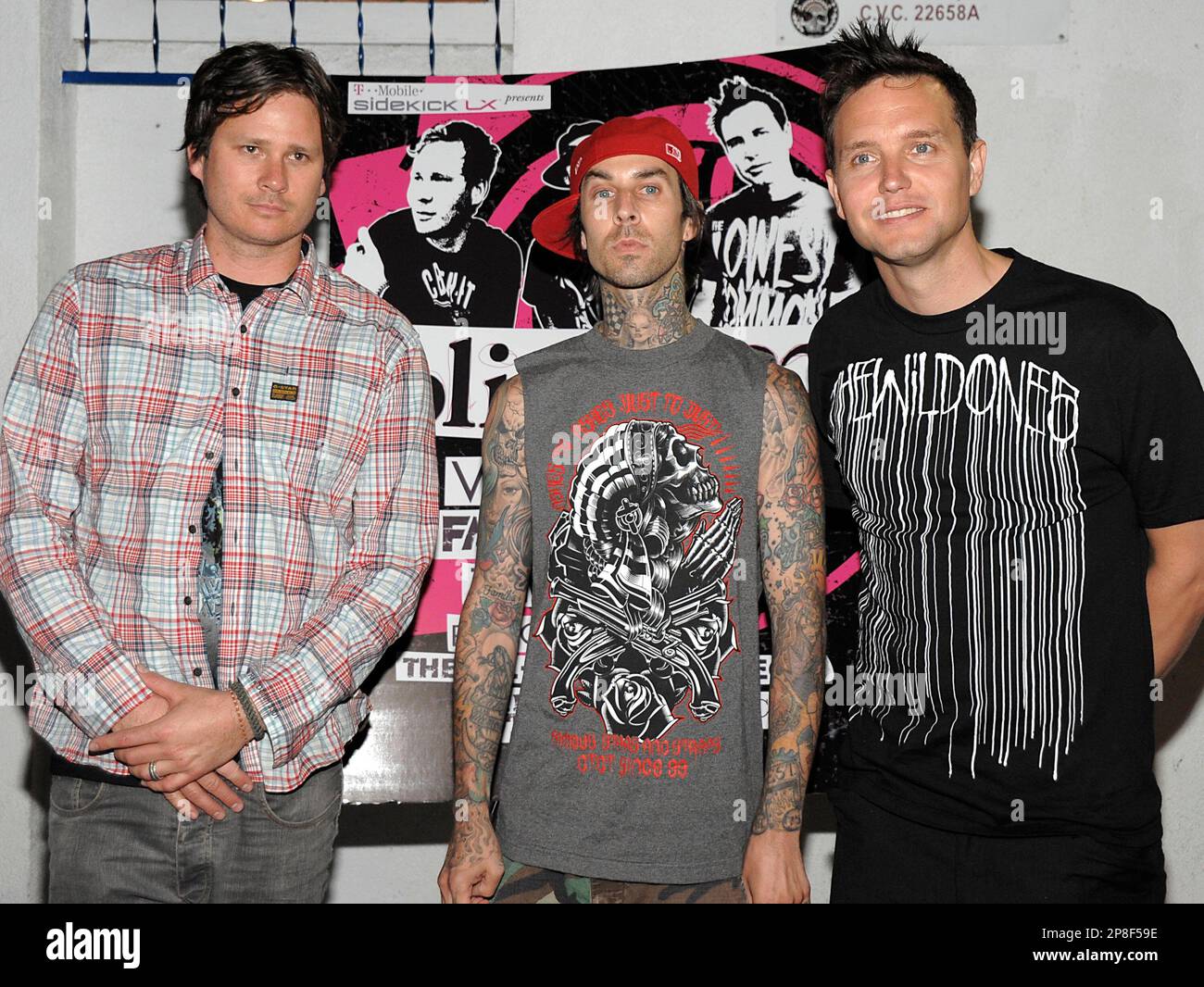 From left to right, musician Tom DeLonge, drummer Travis Barker, and ...