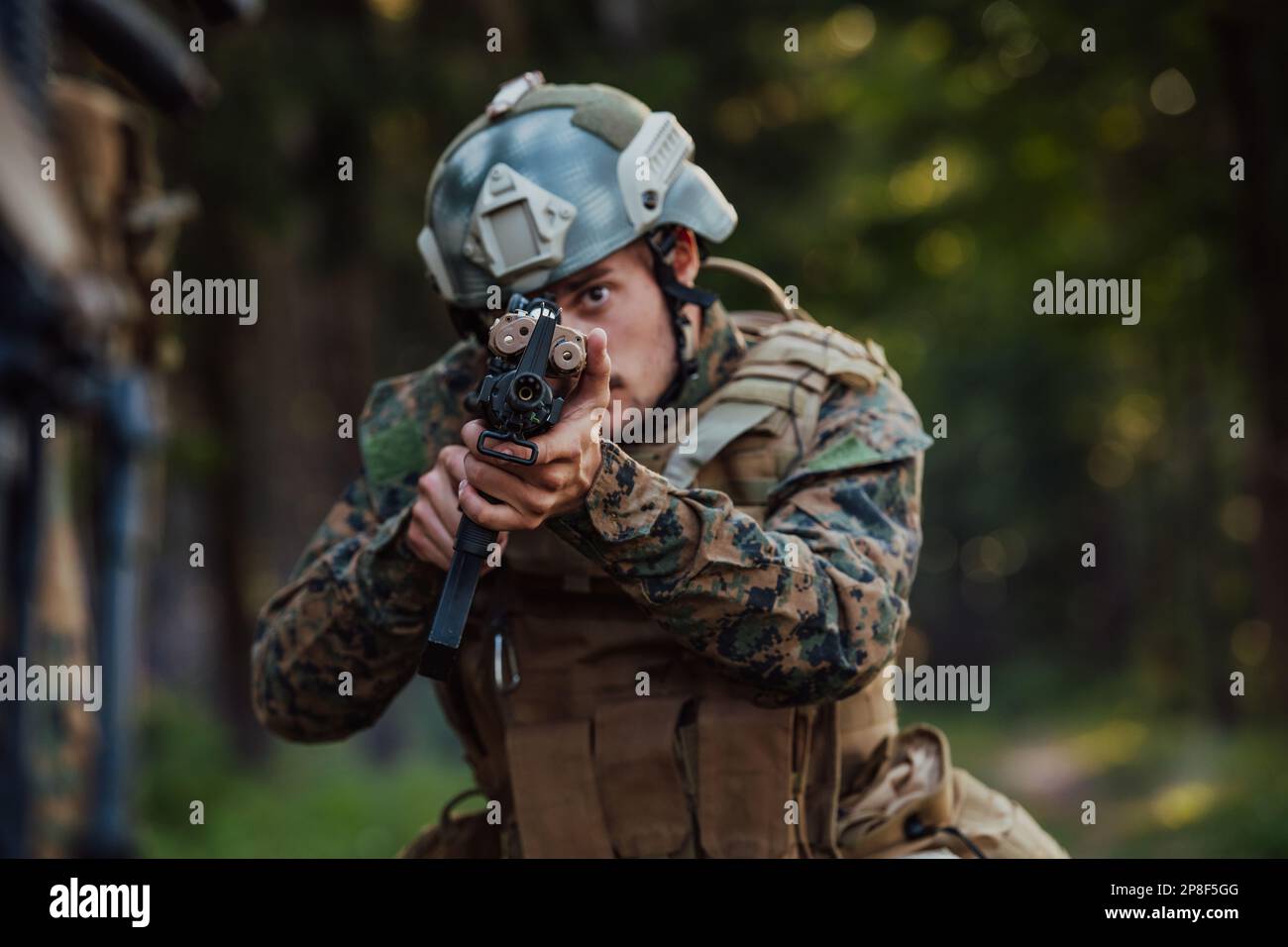 A modern warfare soldier on war duty in dense and dangerous forest ...