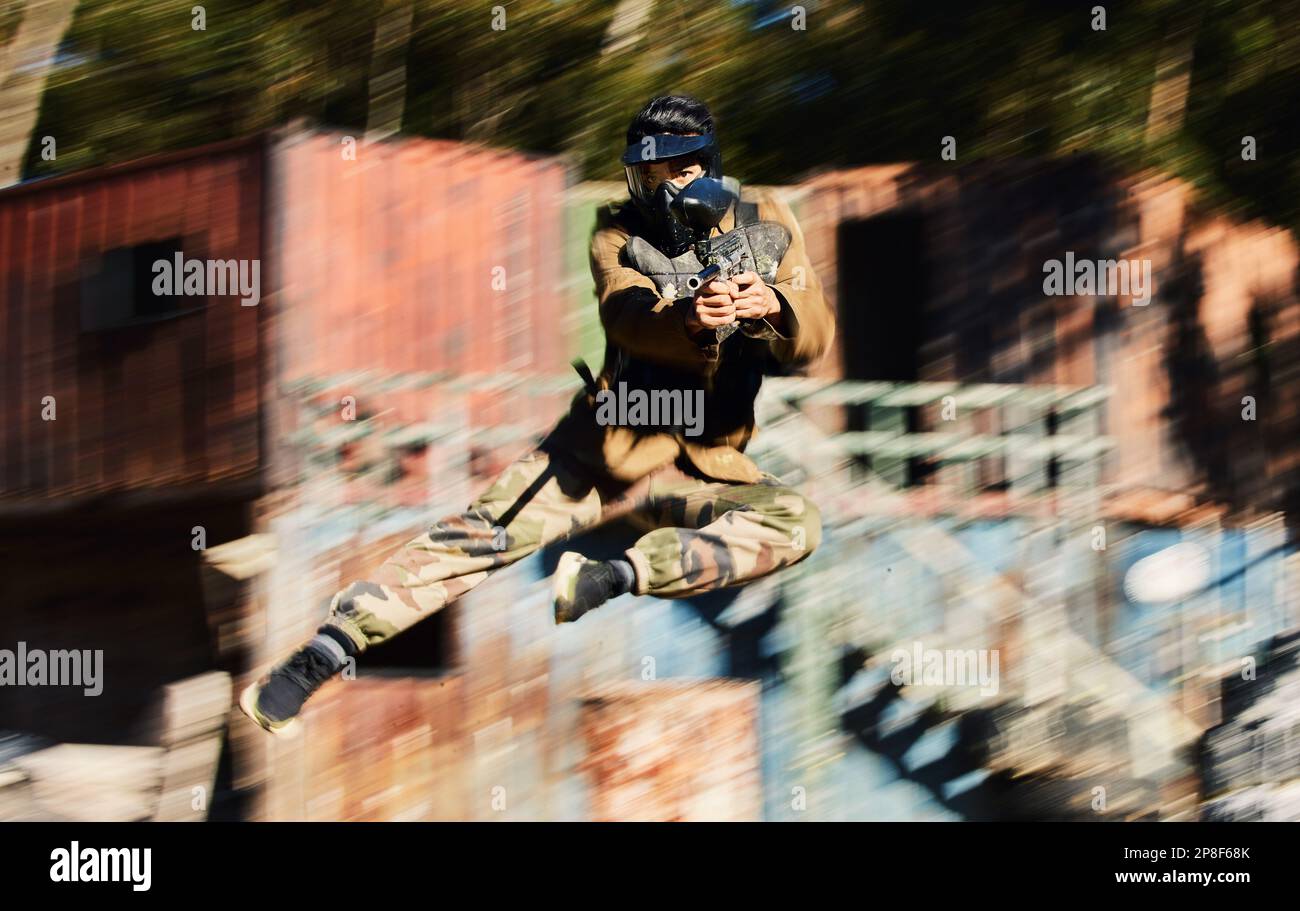Blurred, military and man shooting in paintball, army training and ...