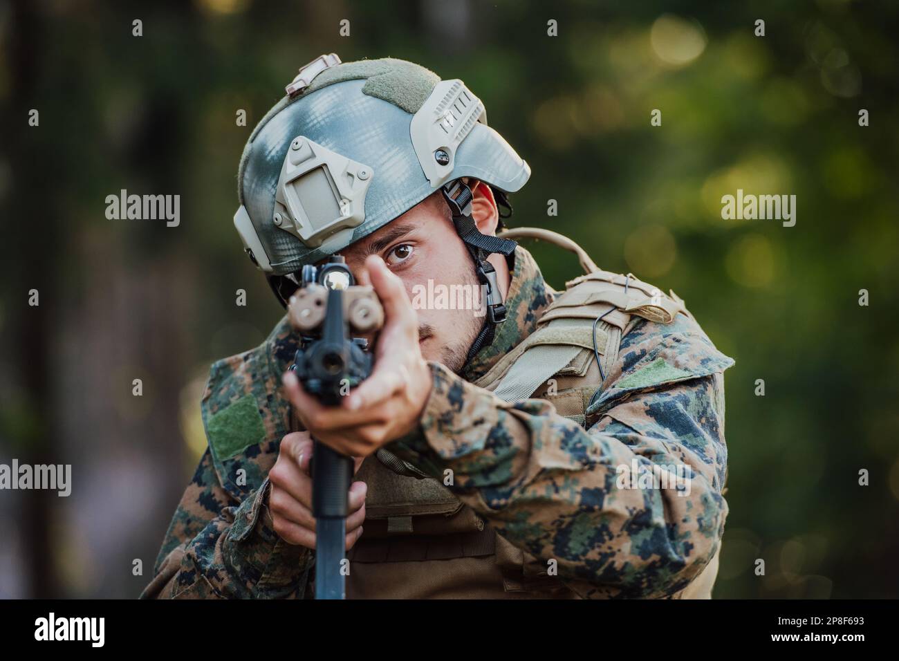 A modern warfare soldier on war duty in dense and dangerous forest ...