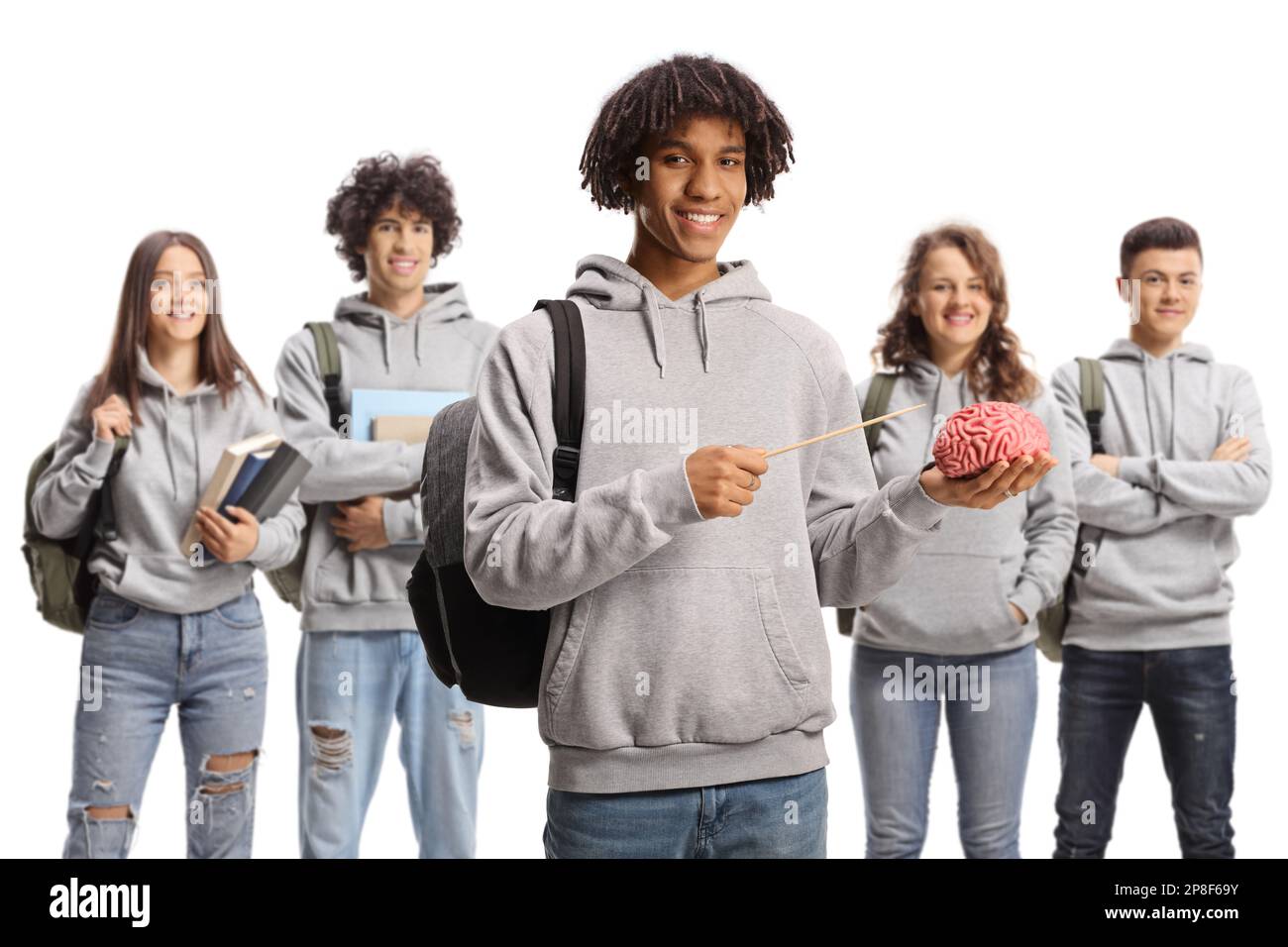 Group of students posing and a male student with a human brain pointing ...