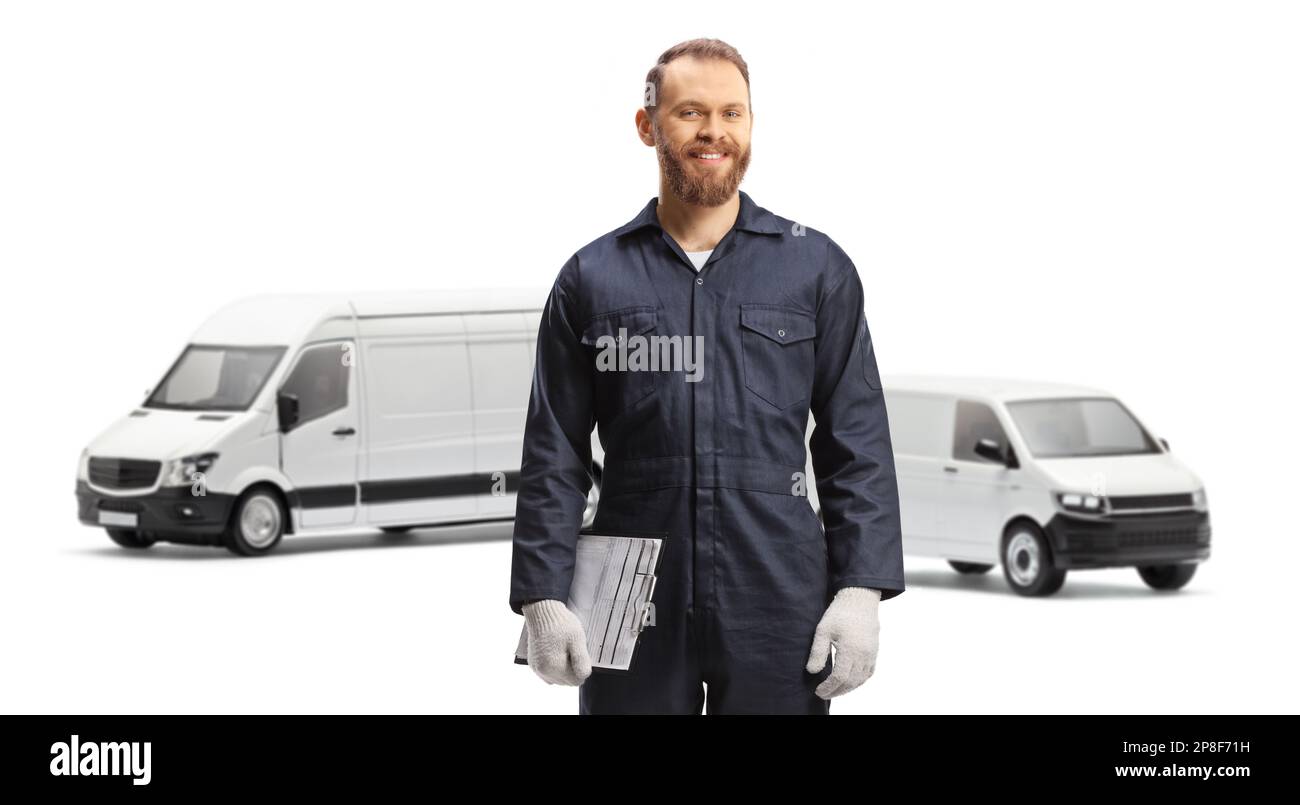 Auto mechanic in a uniform holding a clipboard and posing in front of ...