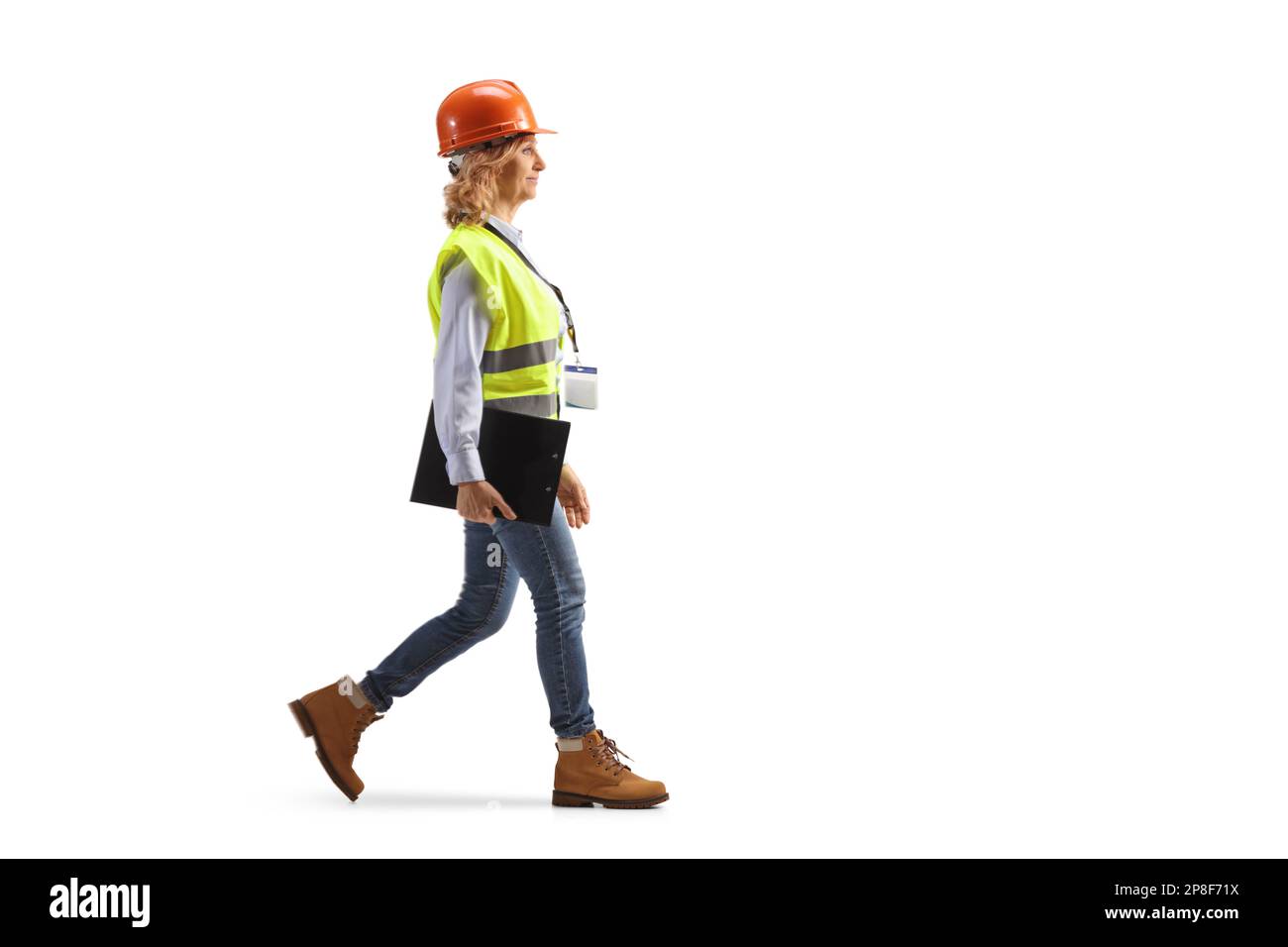 Full length portrait of a female engineer with a safety vest and ...