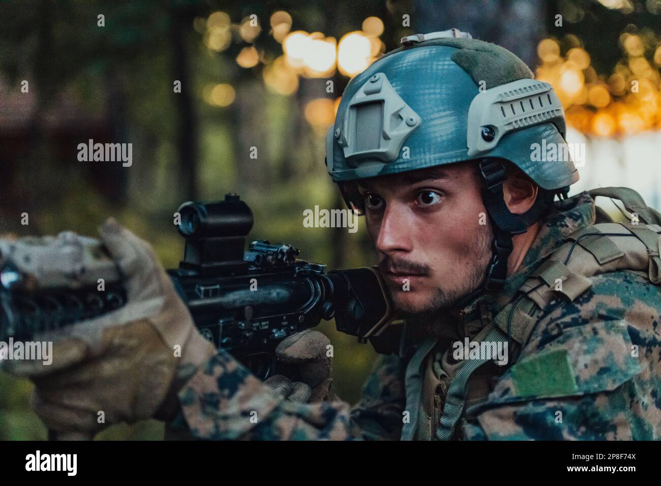 A modern warfare soldier on war duty in dense and dangerous forest ...