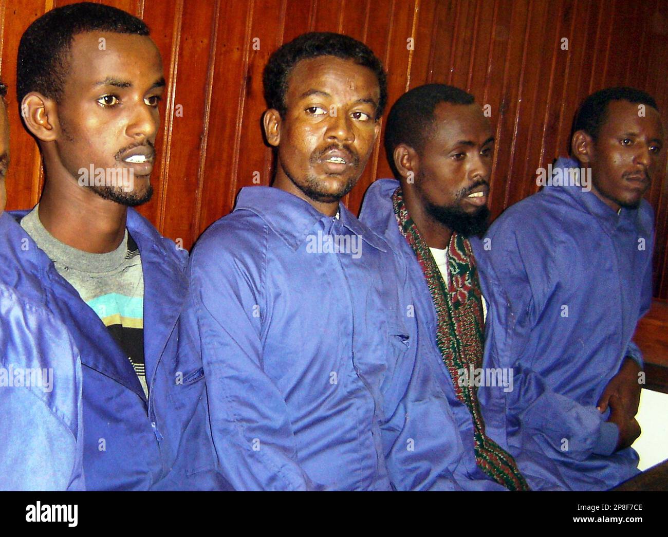 Some of the thirteen suspected Somali pirates who were arrested by a ...