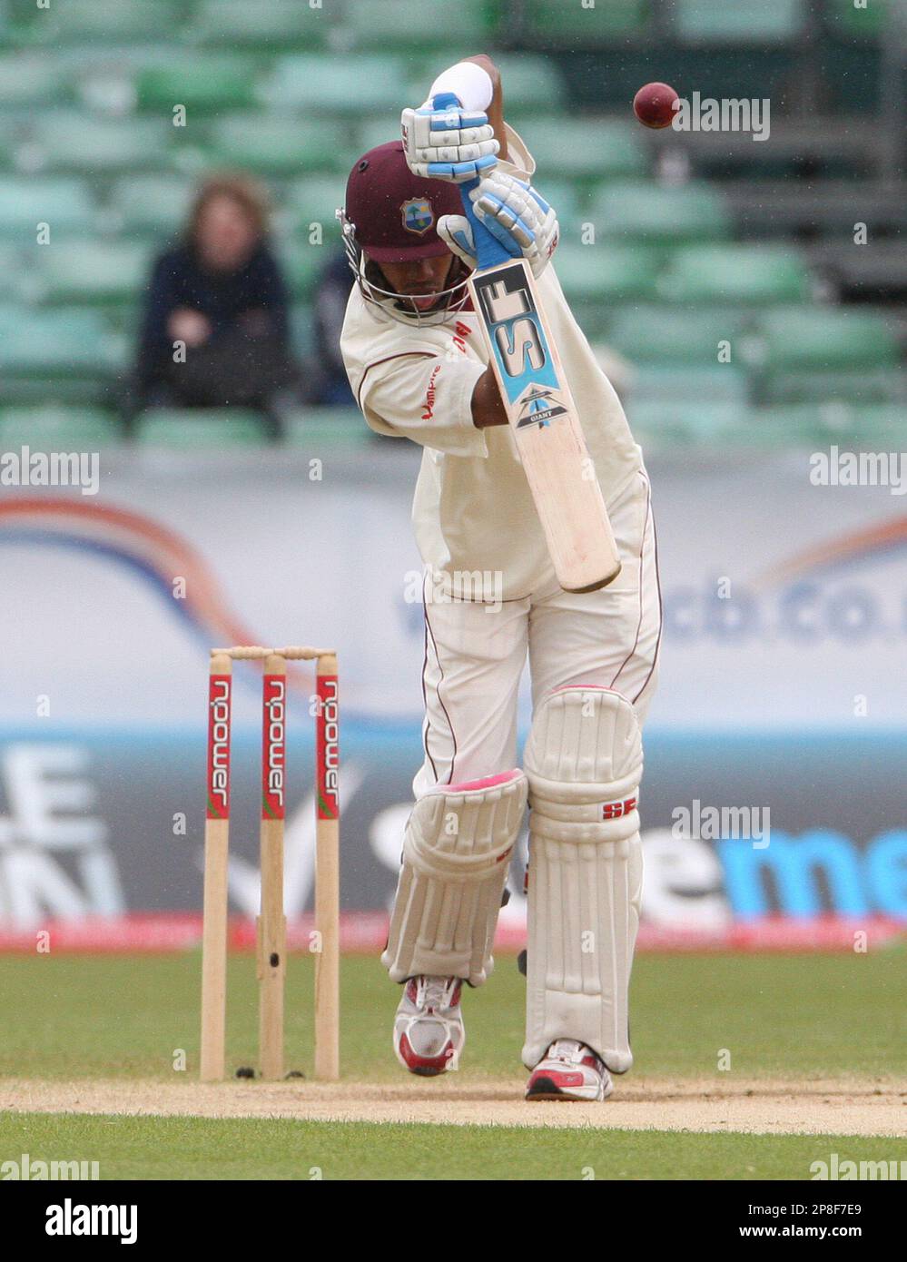 West Indies' Lendl Simmons, hit's a ball from England's James Anderson ...