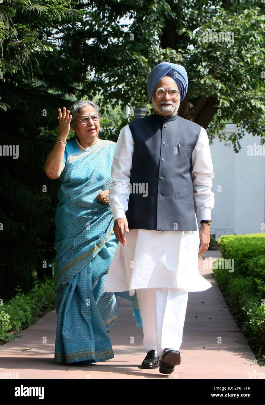 Indian Prime Minister Manmohan Singh, right, with his wife Gursharan ...