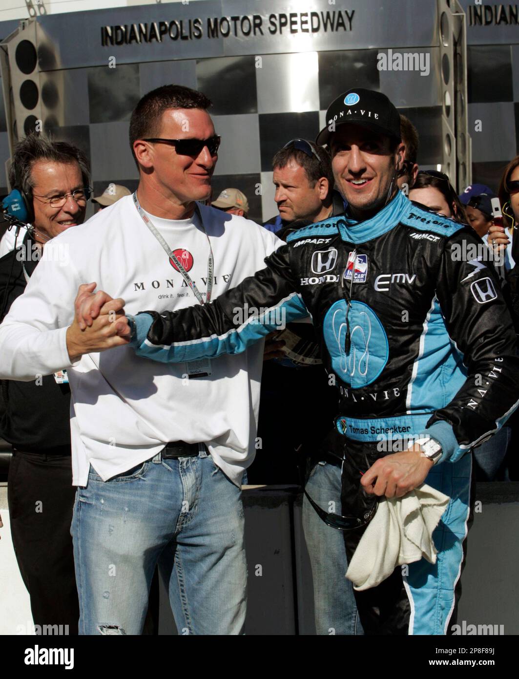 Tomas Scheckter, of South Africa, is congratulated after he qualified ...