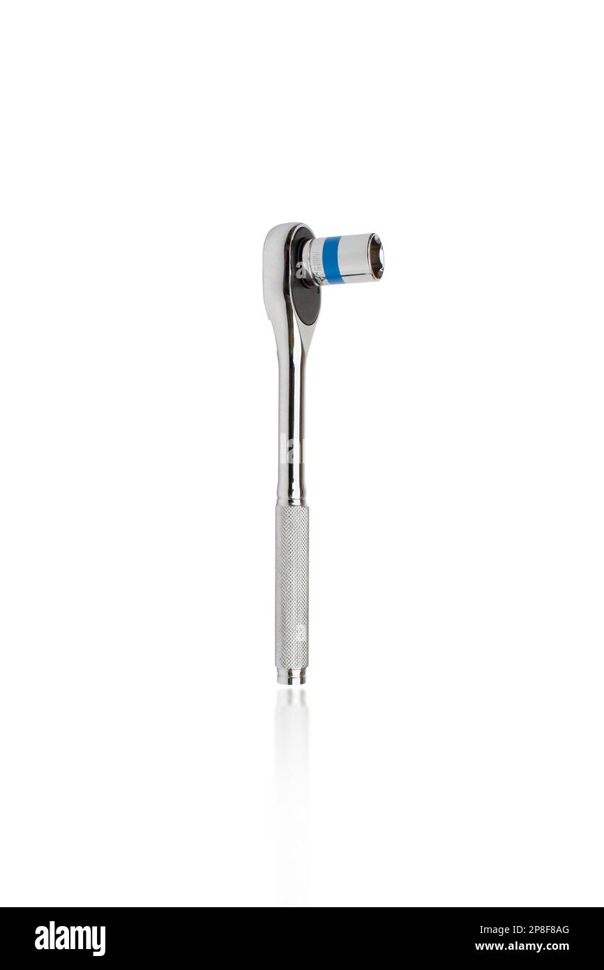 Socket wrench with a metal block isolated on white background with ...