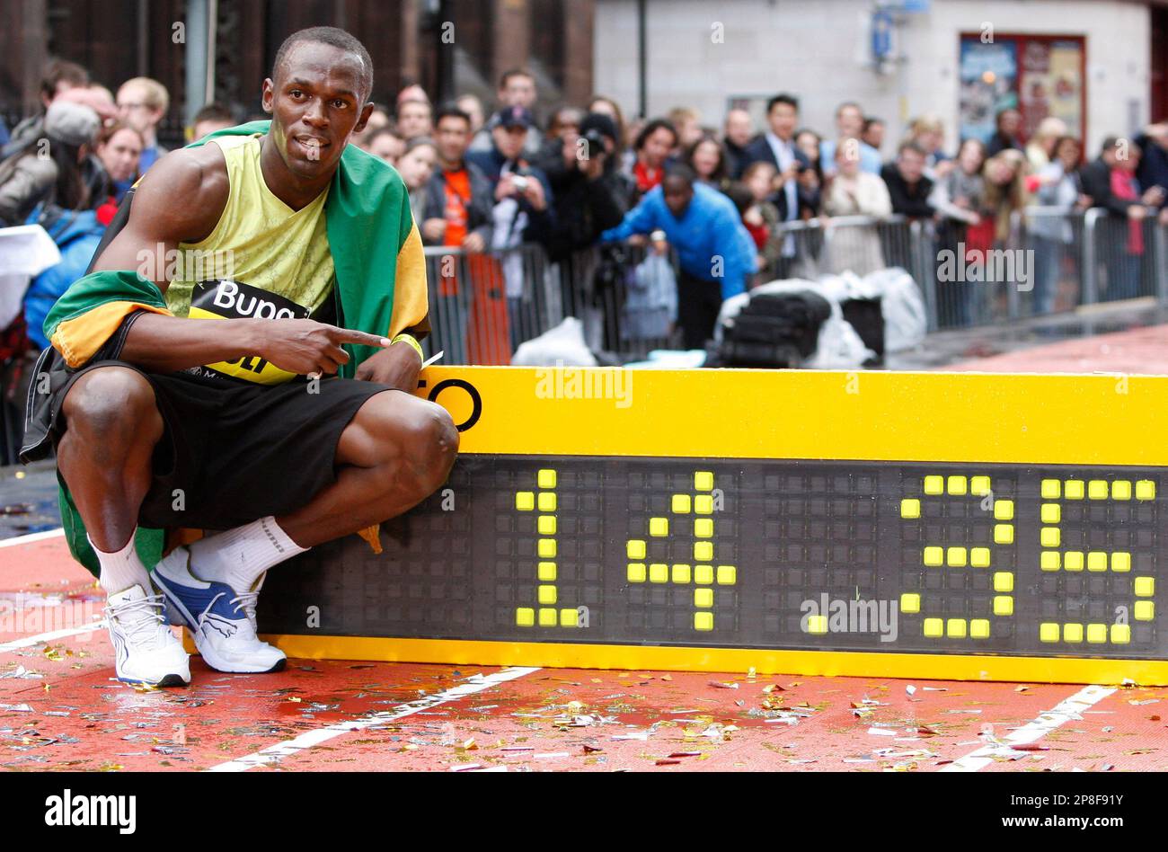 Jamaican athlete Usain Bolt poses for pictures after winning a 150m ...