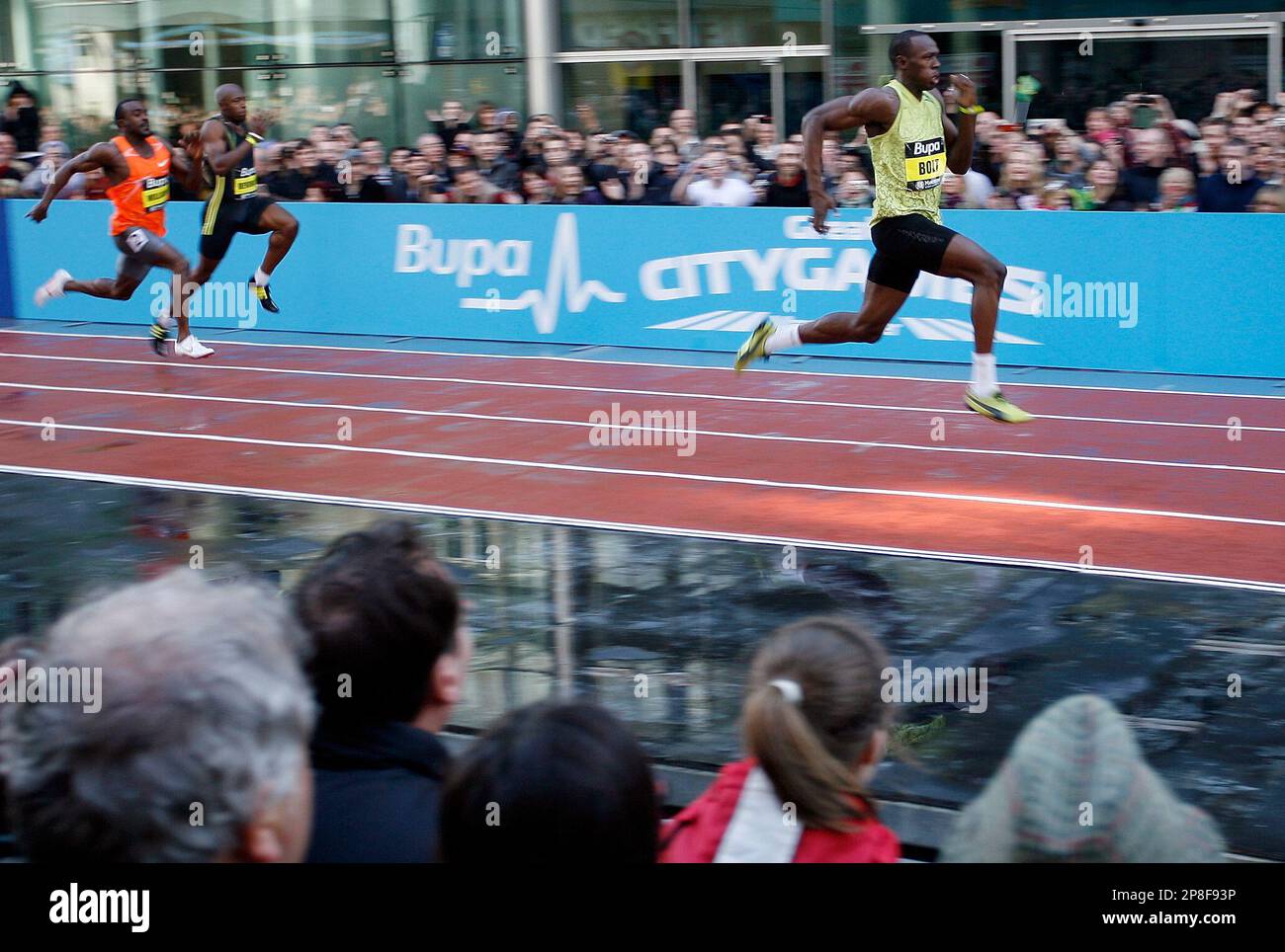 Jamaican Sprinter Usain Bolt, right, is seen in the 150m final during ...