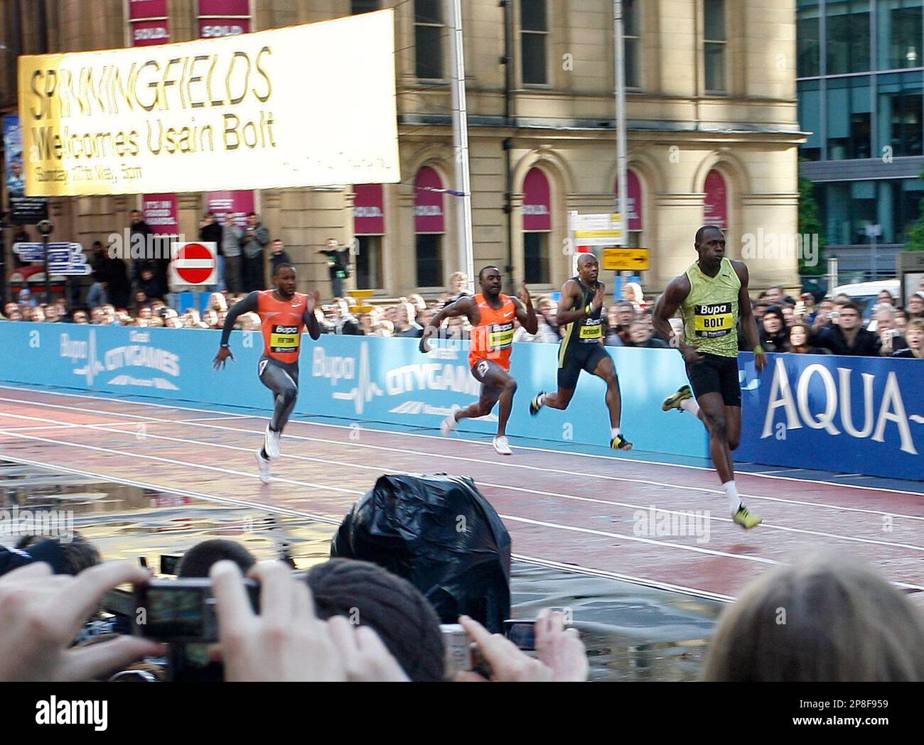 Jamaican Sprinter Usain Bolt, right, is seen in the 150m final during ...