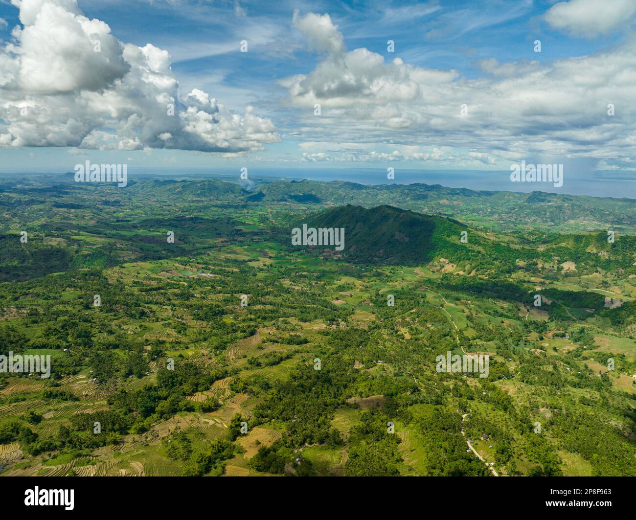 Aerial view of farmland on the slopes of hills in the mountainous ...