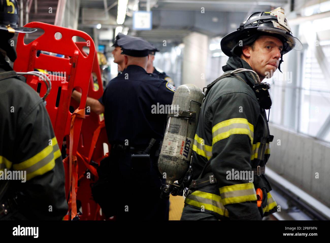 A firefighter looks down the train tracks during a drill in New York ...