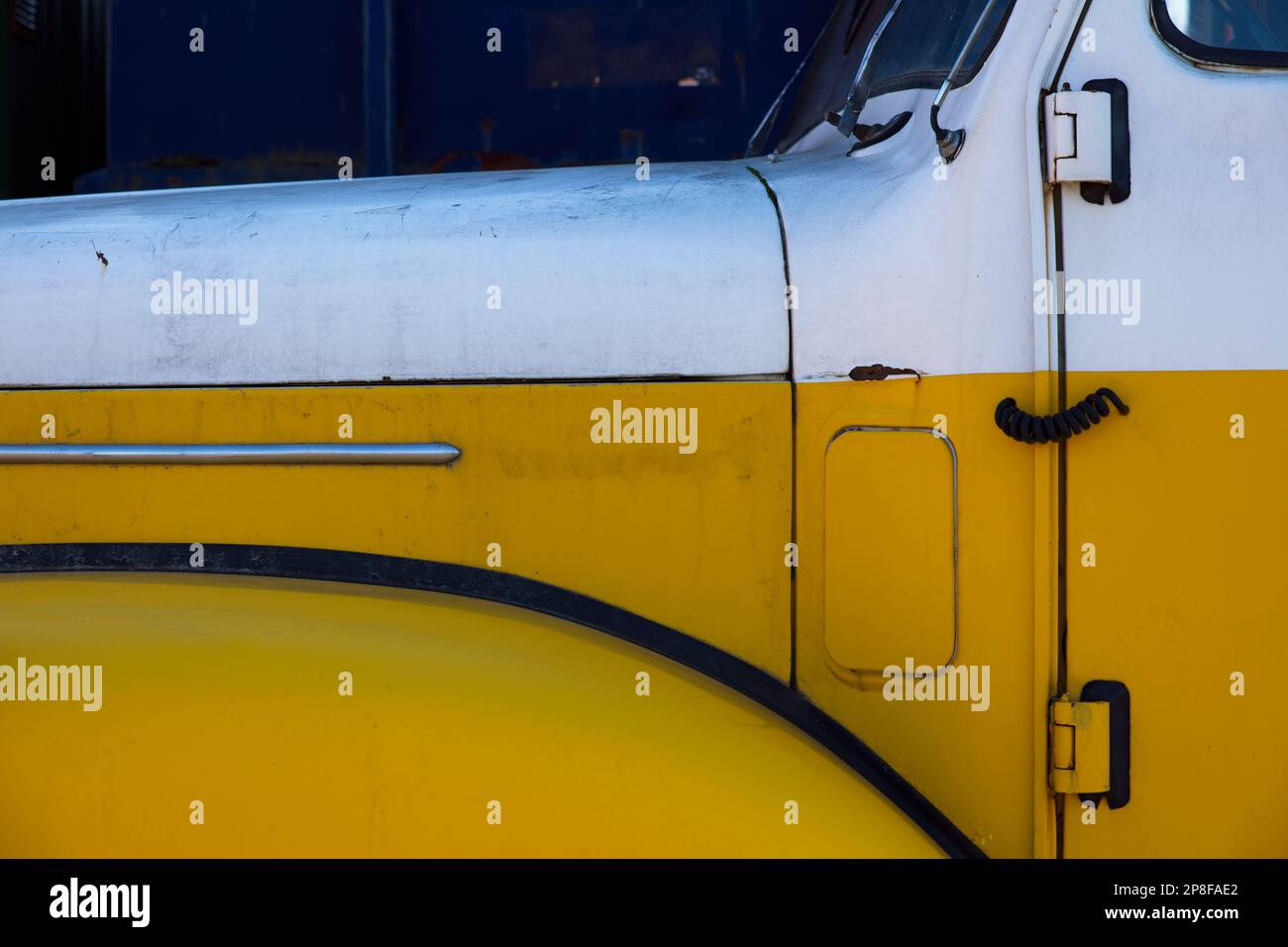 Closeup of fuel tank cover on a a colorful old truck cabin side view ...