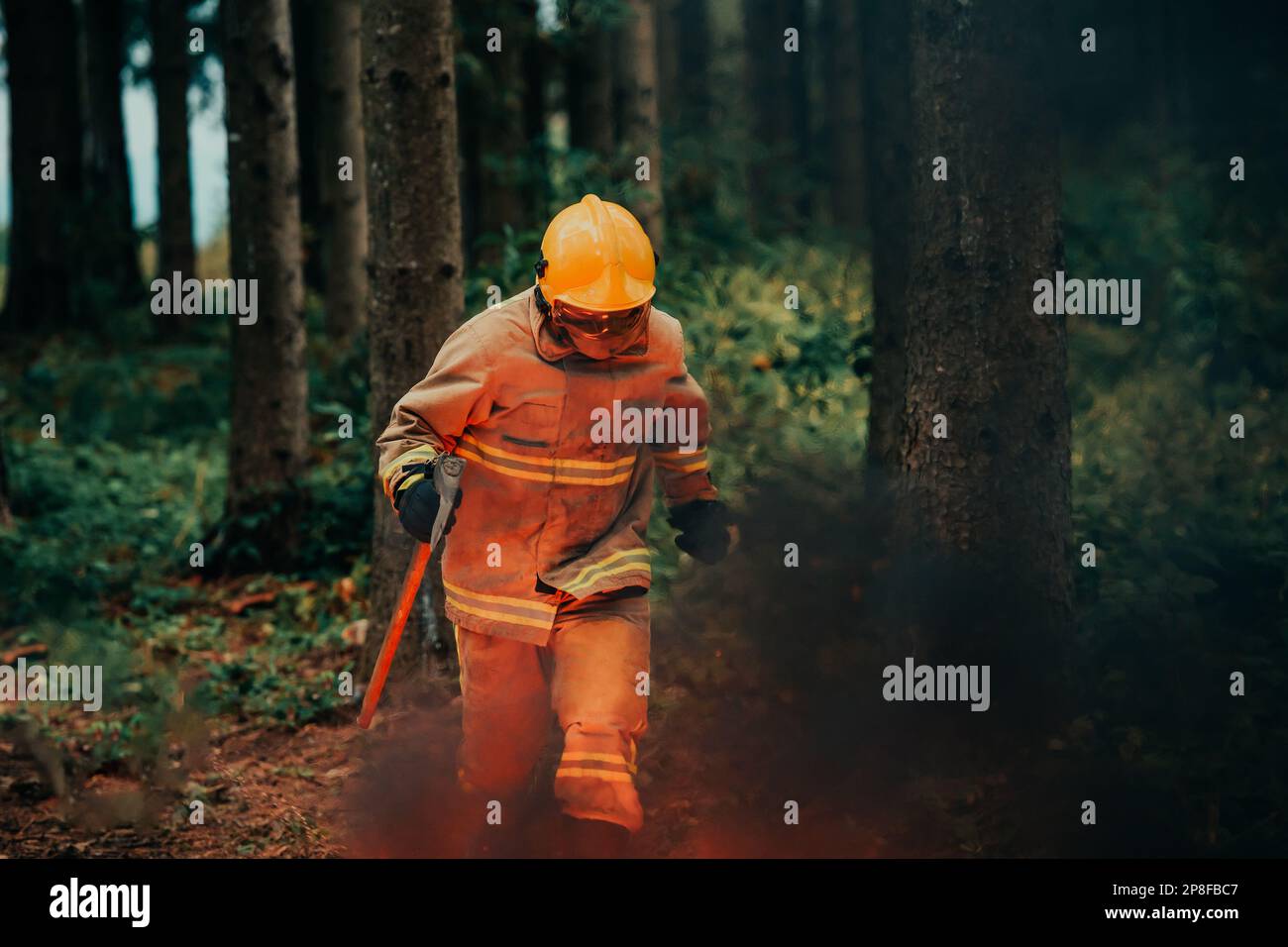 firefighter hero in action danger jumping over fire flame to rescue and ...