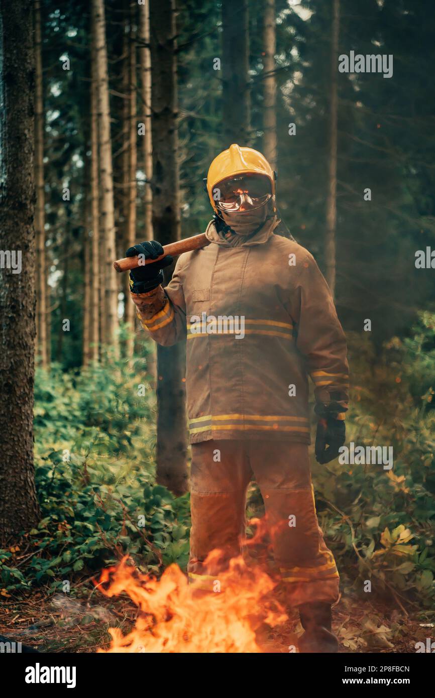 Firefighter at job. Firefighter in dangerous forest areas surrounded by ...