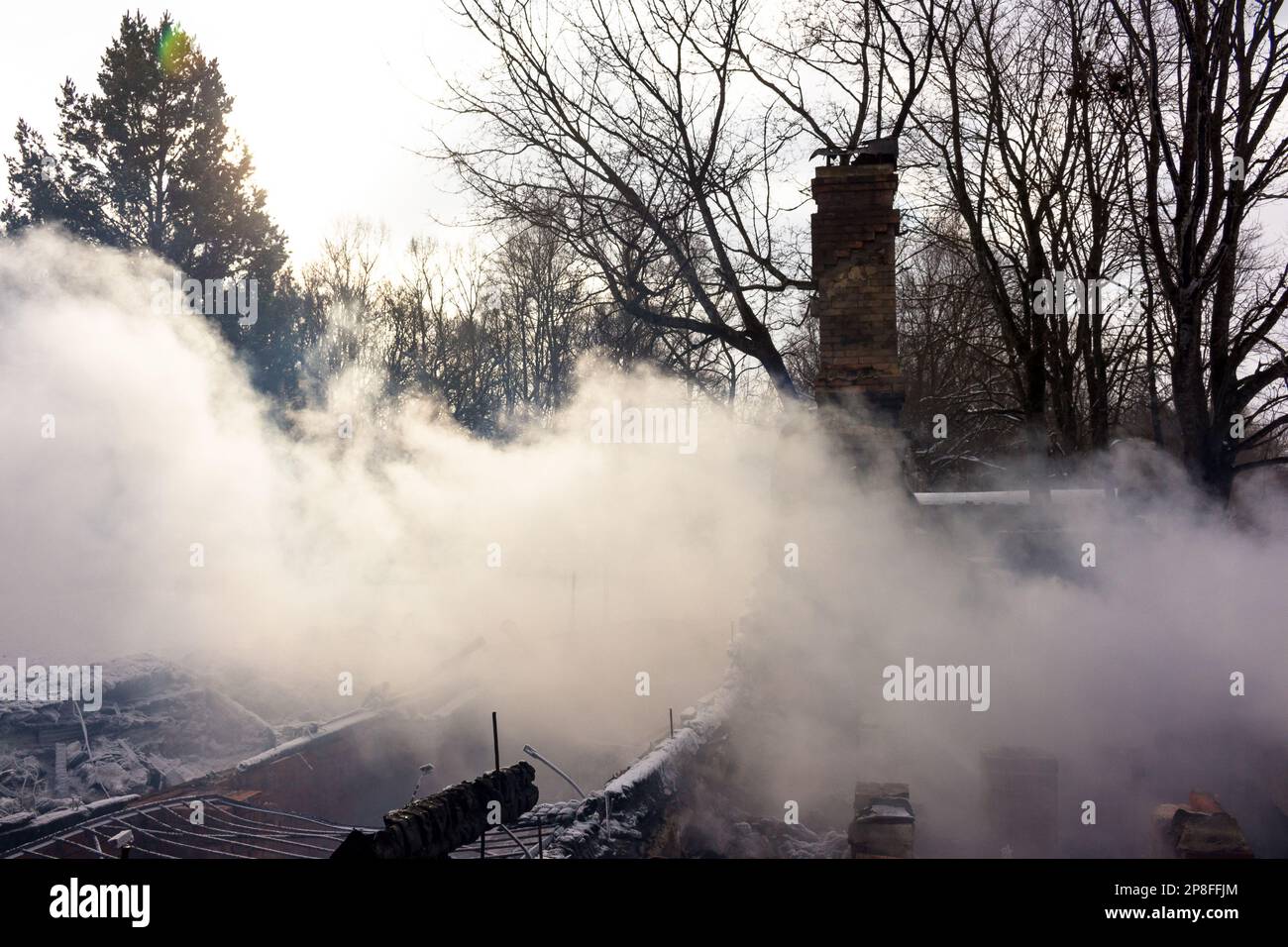 Dense smoke after a fire in the building, the remains of the floor and ...