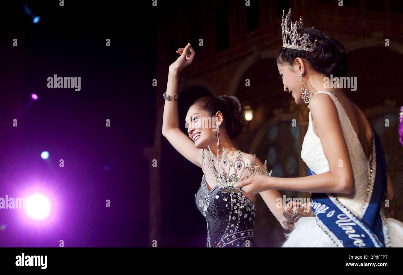 Sorrawee Nattee, 20, of Thailand, reacts to winning the Miss Tiffany's ...