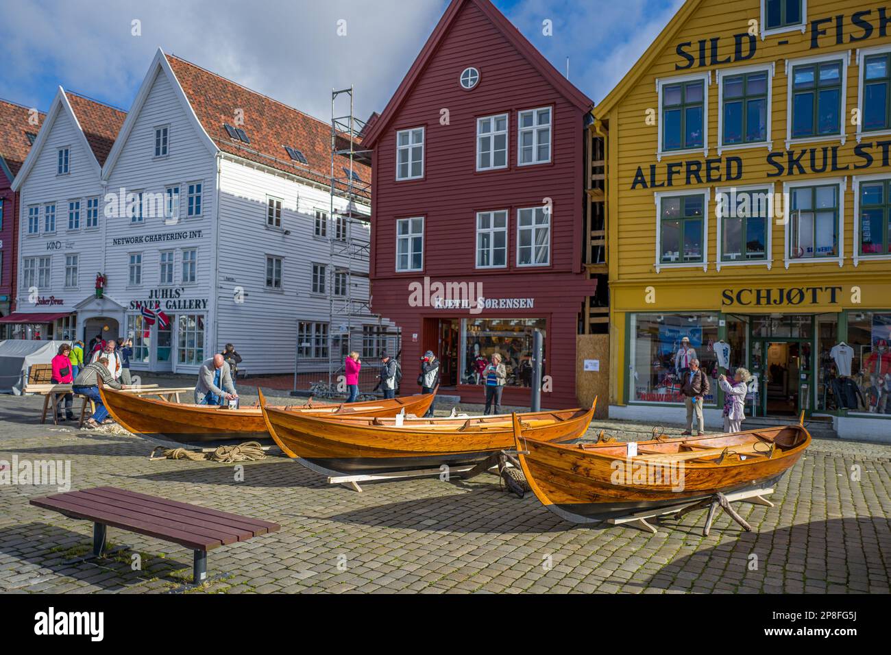 Traditional Oselvar rowing boats displayed at Bryggen. Bryggen is a ...