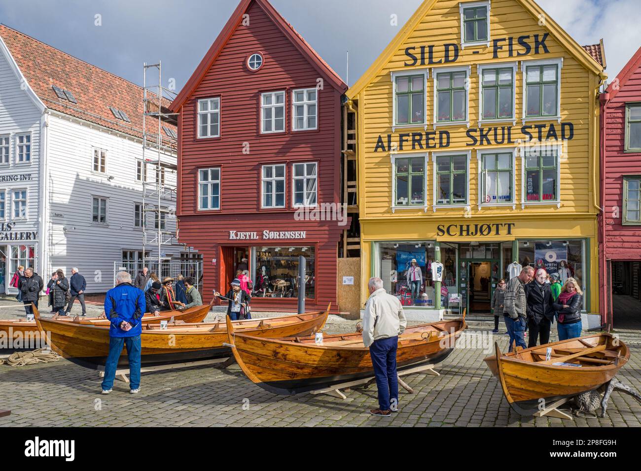 Traditional Oselvar rowing boats displayed at Bryggen. Bryggen is a ...